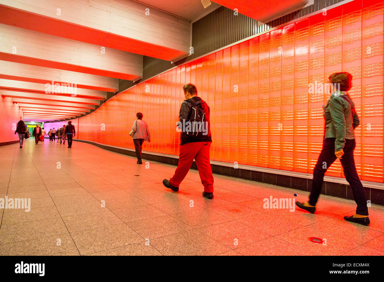Passengers in an underground passage with a wall of lights Stock Photo ...