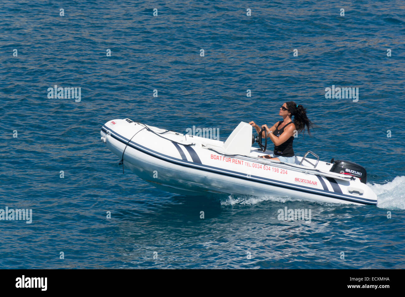 Girl driving motorboat hi-res stock photography and images - Alamy