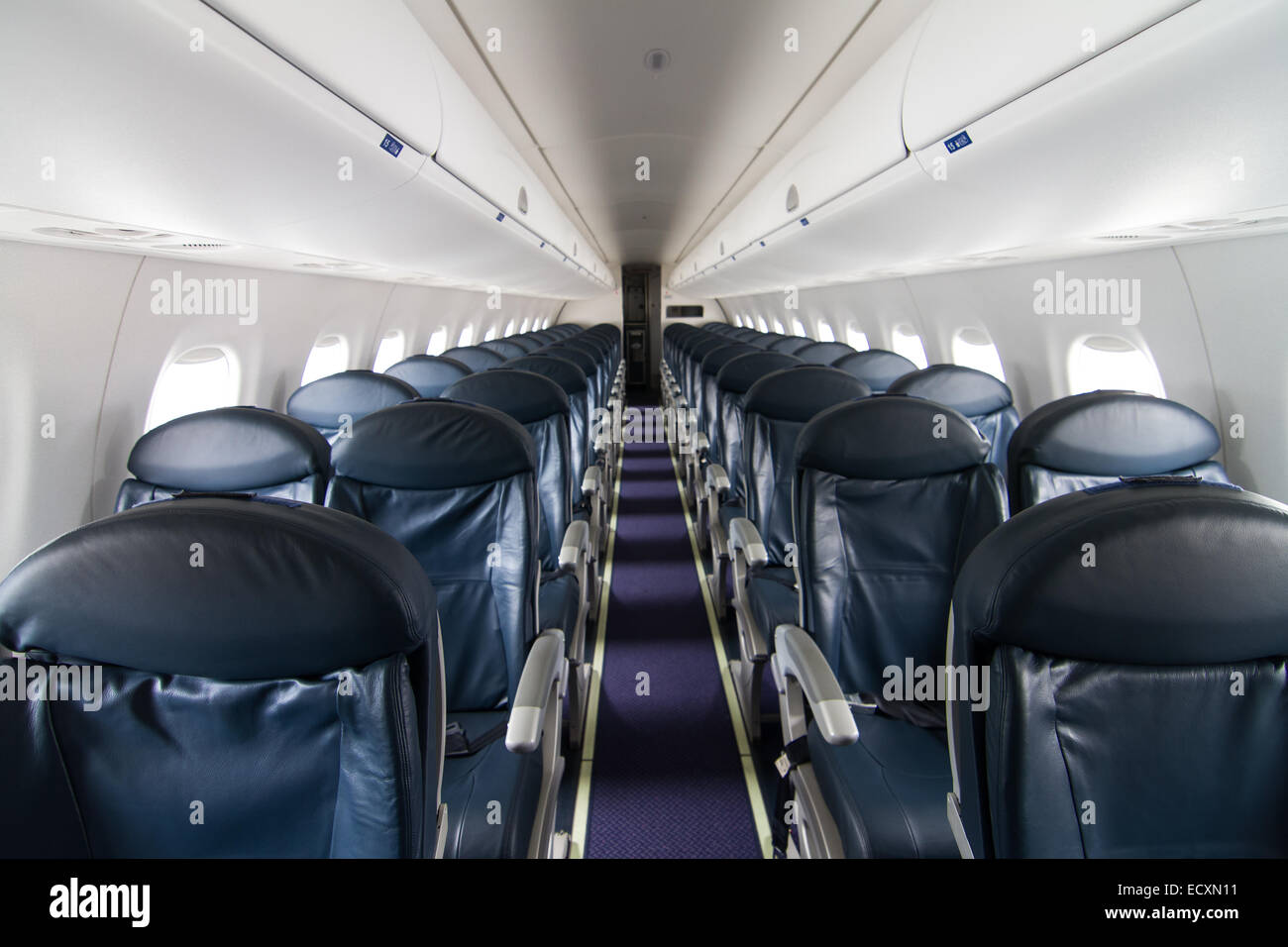 Dark Blue Seats in a Empty Jet Airplane Stock Photo - Alamy
