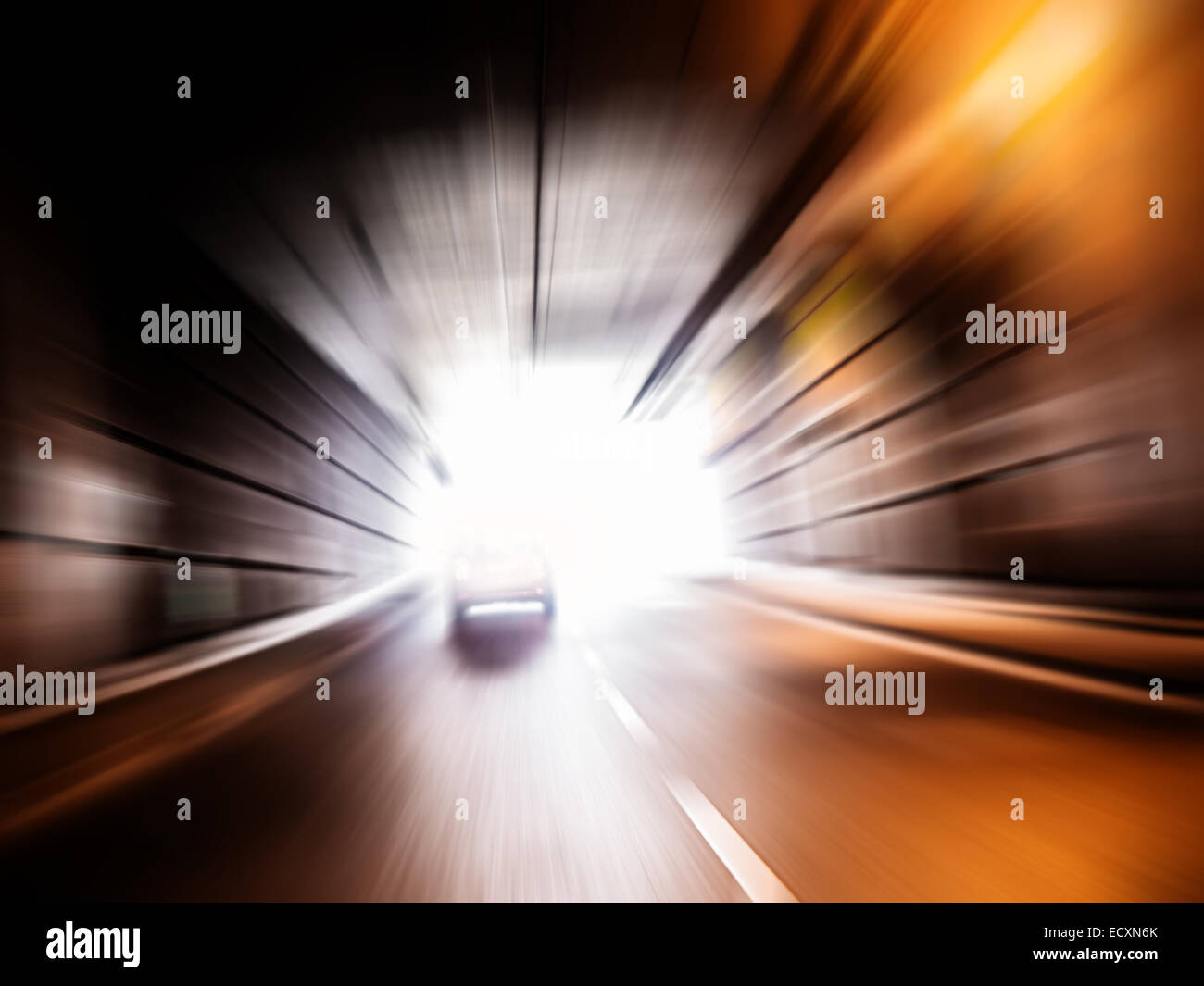 very fast car in a tunnel (orange light Stock Photo - Alamy