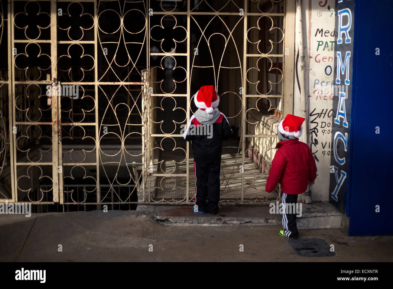 Tijuana, Mexico. 21st Dec, 2014. Children wear hats of Santa Claus ...