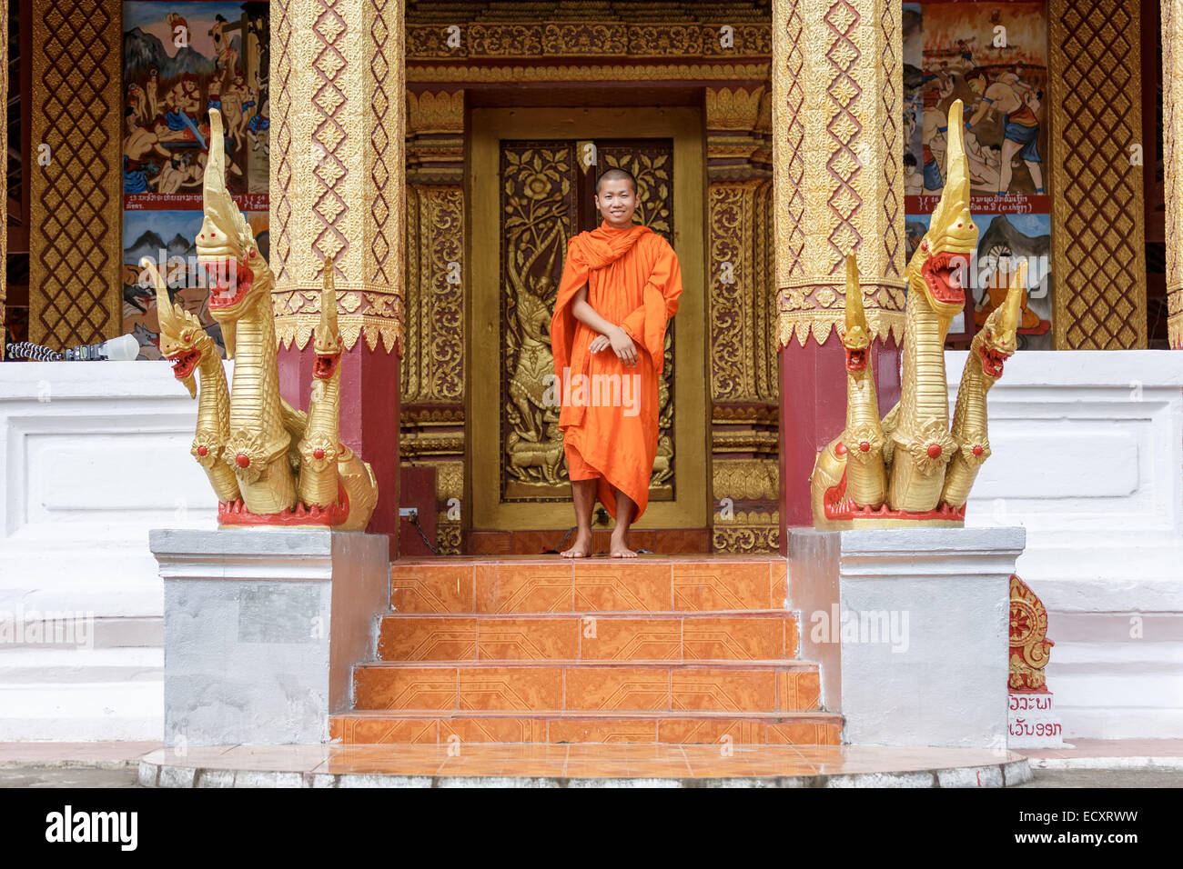 Young Buddhist Monk Standing And Smiling To The Camera Stock Photo - Alamy