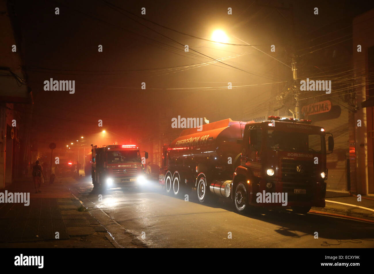 Sao Paulo, Brazil. 21st Dec, 2014. Fire engines arrive at the site of a ...