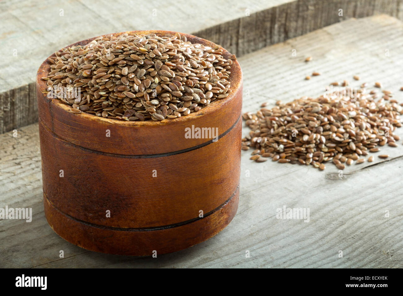 Flax seeds in bowl on wooden background Stock Photo - Alamy