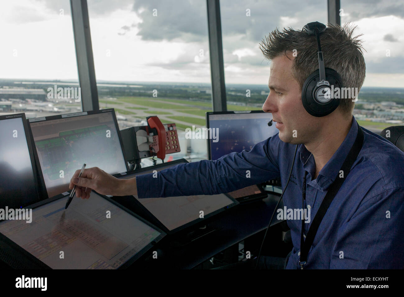 NATS Heathrow air traffic controller in control tower at Heathrow ...