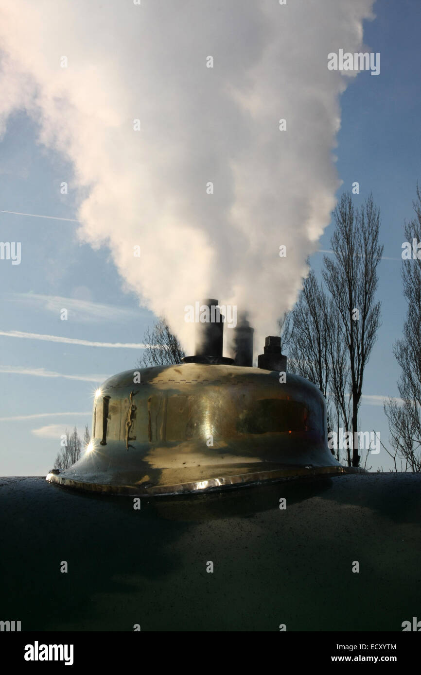 Steam from pressure release on old locomotive Stock Photo - Alamy