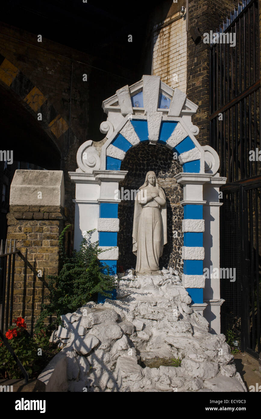 An effigy of the virgoin Mary in a shrine outside a Catholic church in ...