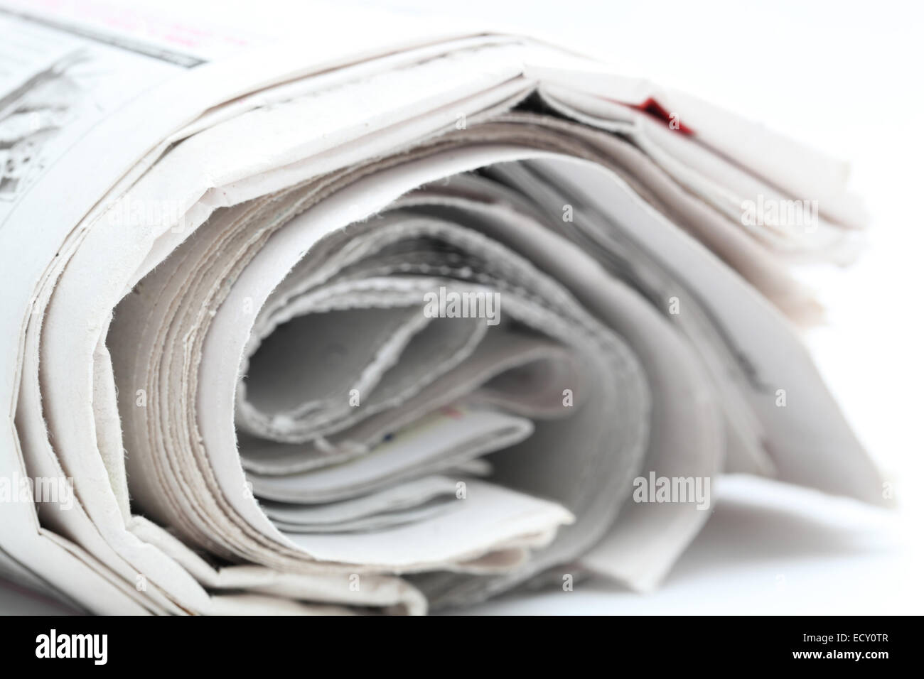 newspaper roll isolated on white background Stock Photo - Alamy