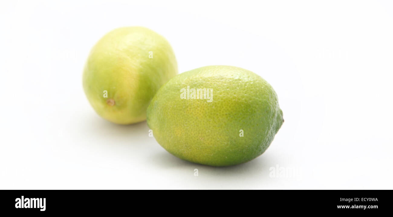 two limes on white background Stock Photo - Alamy