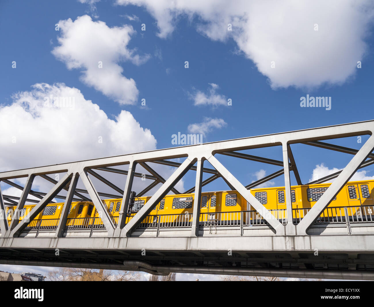 a train on a bridge in berlin in spring time Stock Photo - Alamy