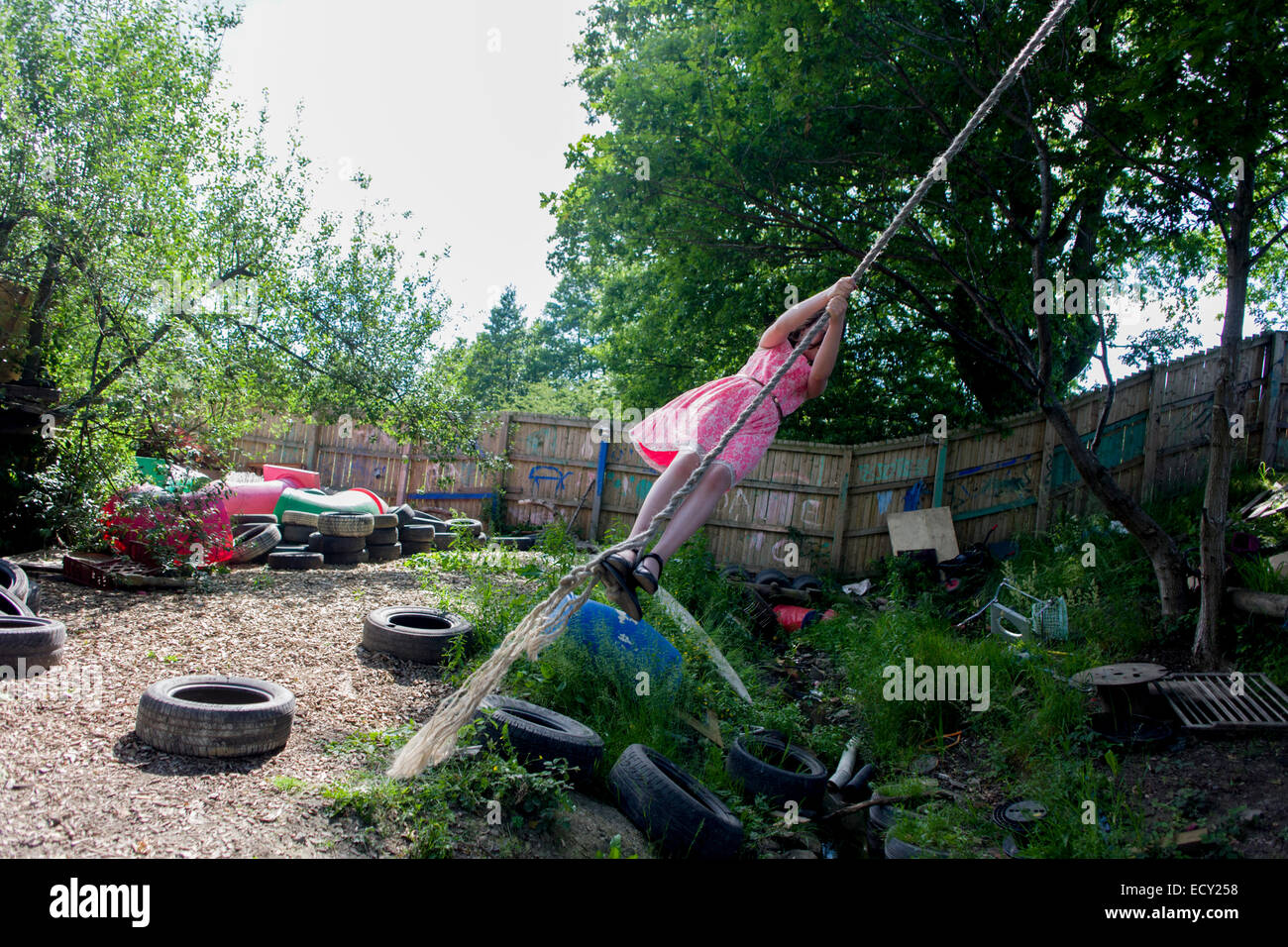 Girl swings on rope swing in risk averse playground called The Land on ...