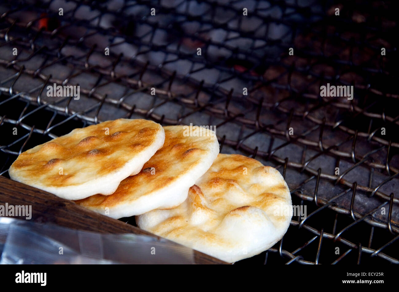 Traditional Japanese Rise Cookie, Senbei or Sembei, being grilled over ...