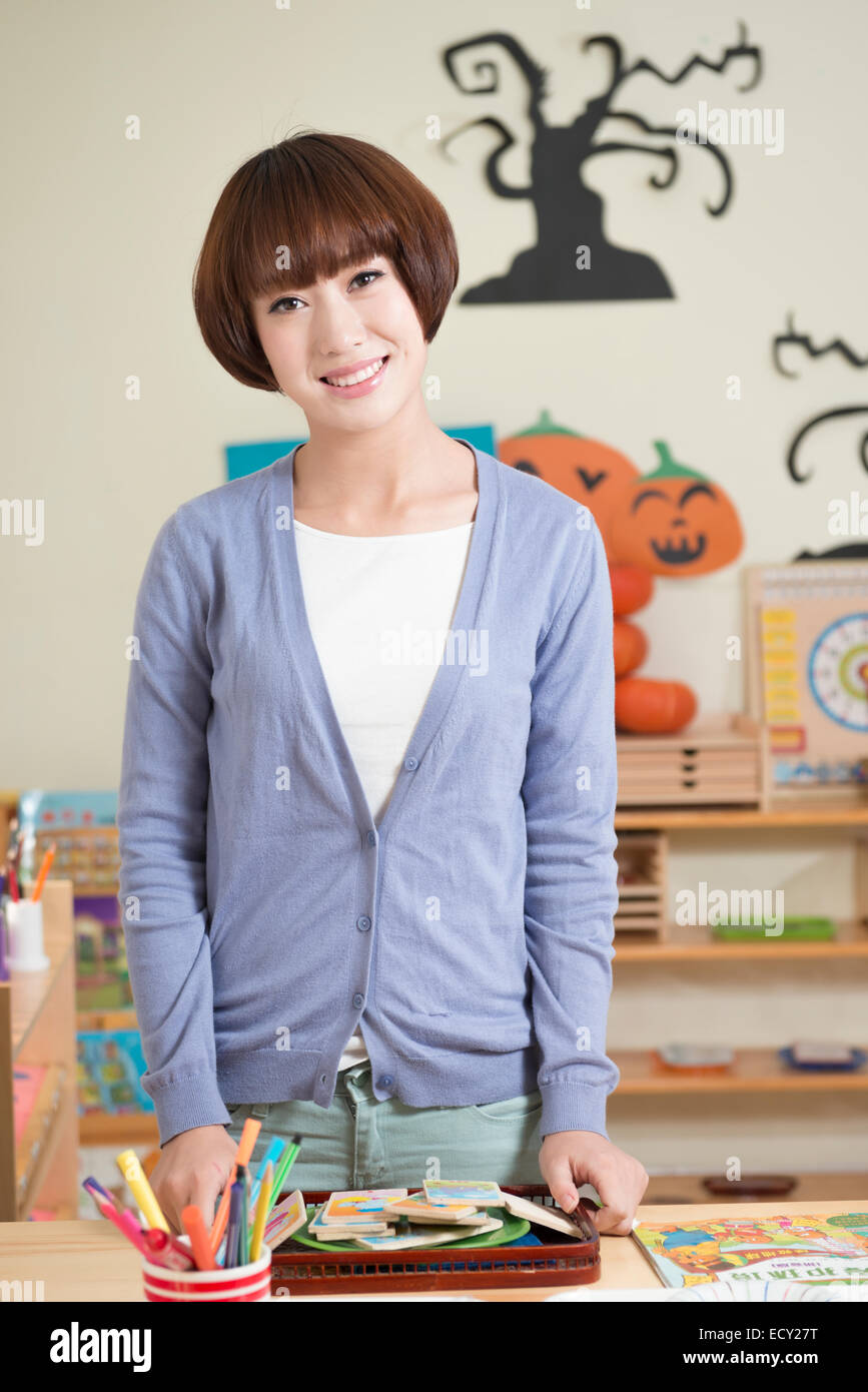 Female kindergarten teacher Stock Photo - Alamy