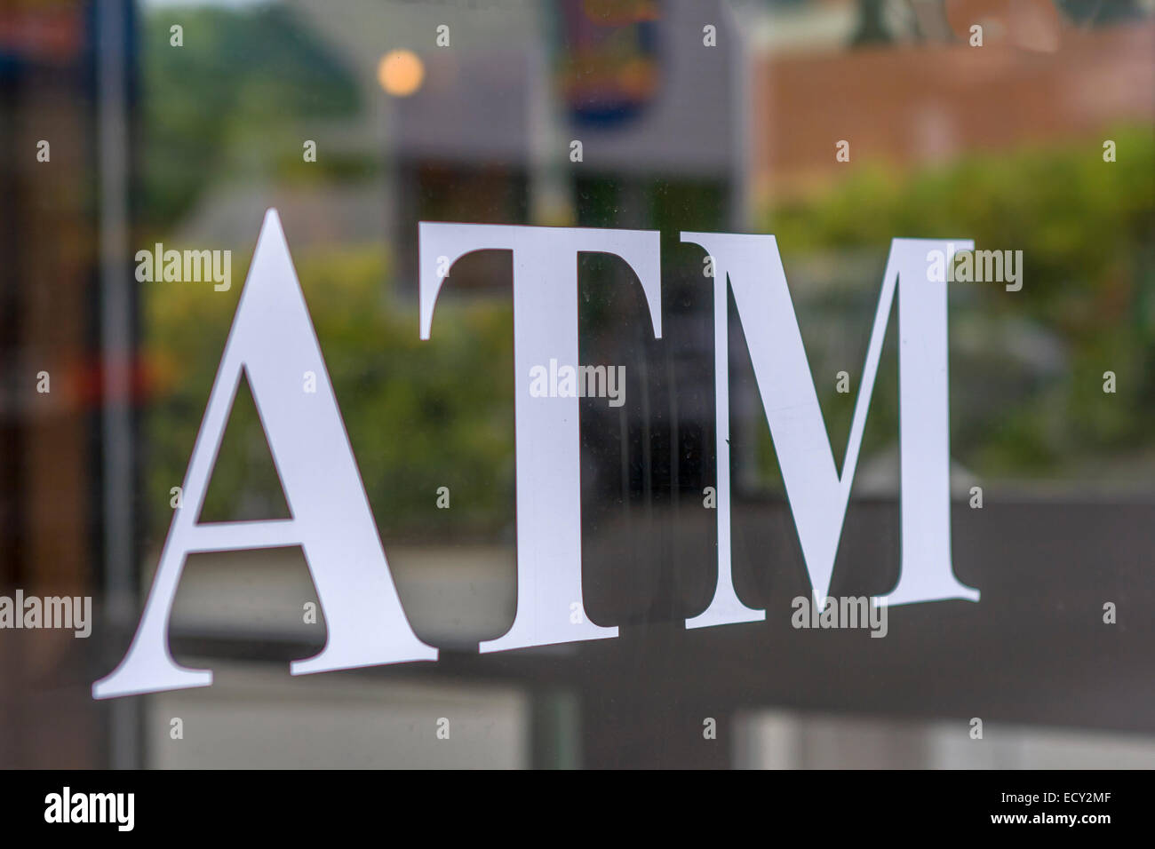 The word 'ATM' on the window of bank Stock Photo - Alamy