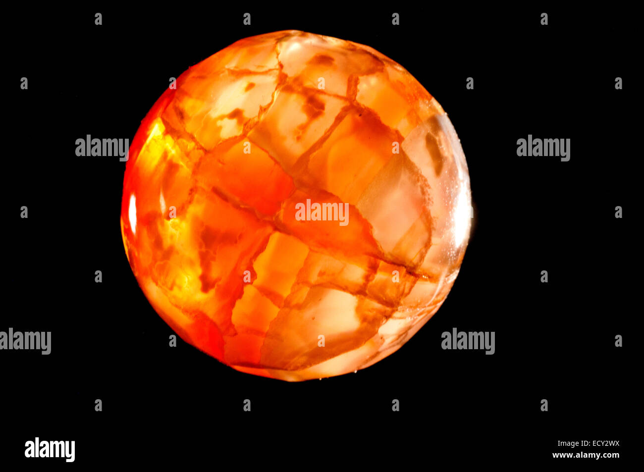 Yellow agate mineral stone sphere in studio setting Stock Photo - Alamy