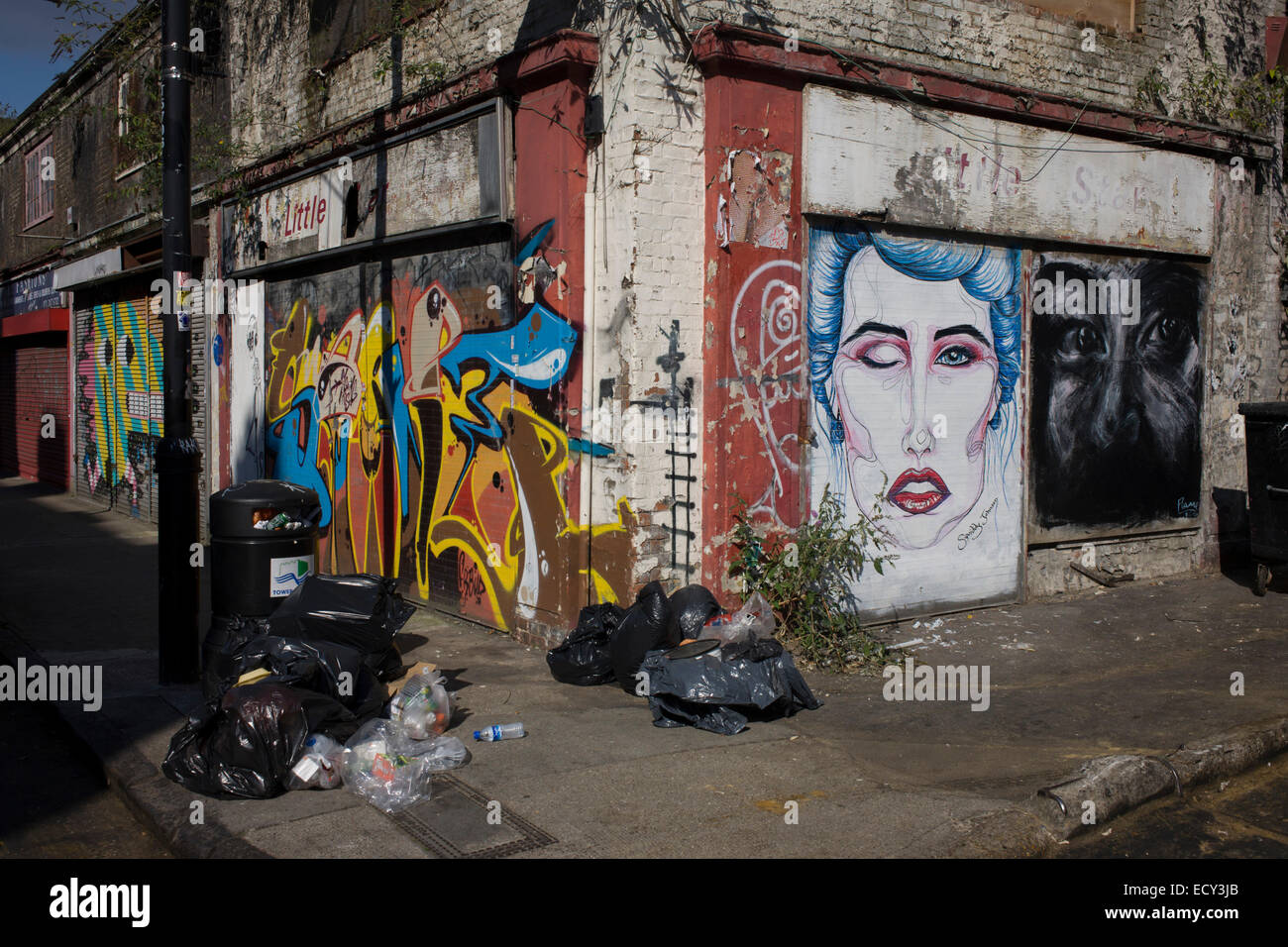 Rubbish and former shops on Toynbee Street in east London Stock Photo ...