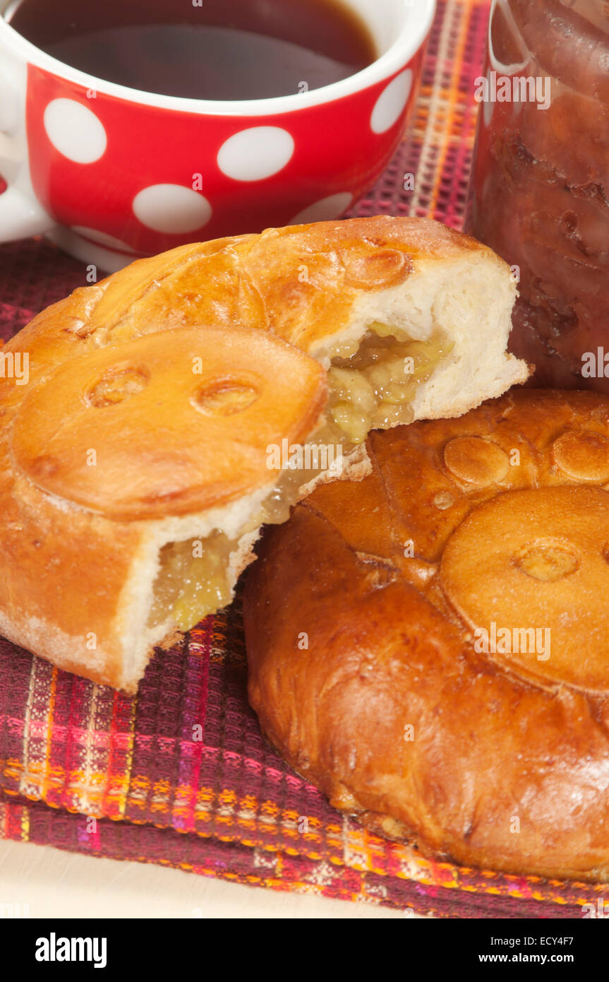 "Pig" pies with apple jam and tea, closeup Stock Photo - Alamy
