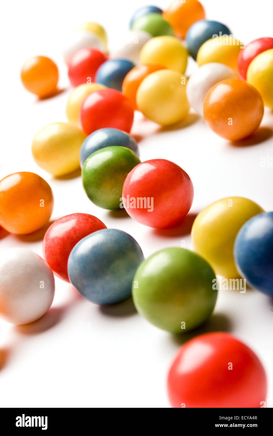 colorful gum-balls on a white background Stock Photo - Alamy