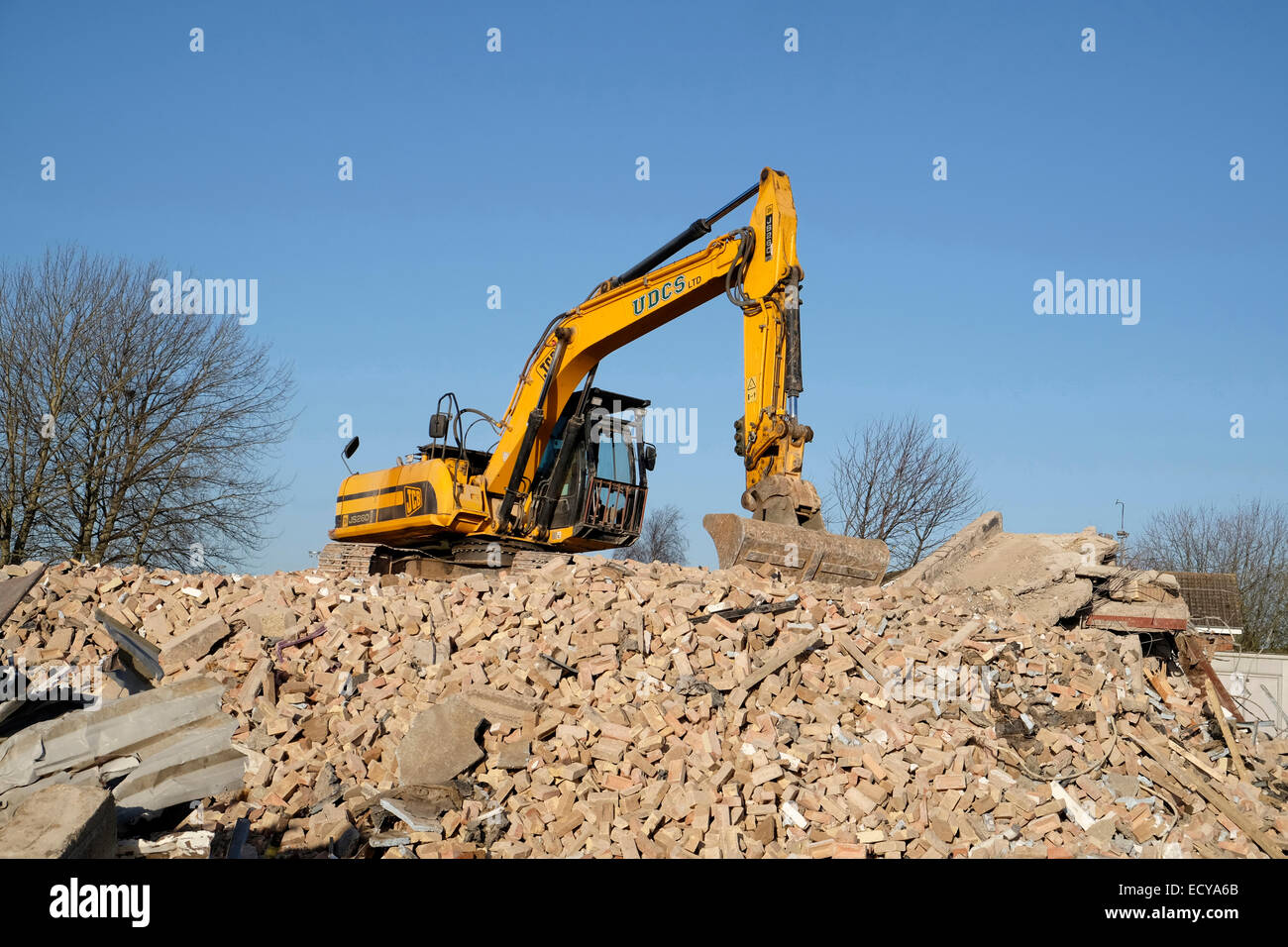 Heavy plant machinery removing rubble from a demolished house, Grantham ...