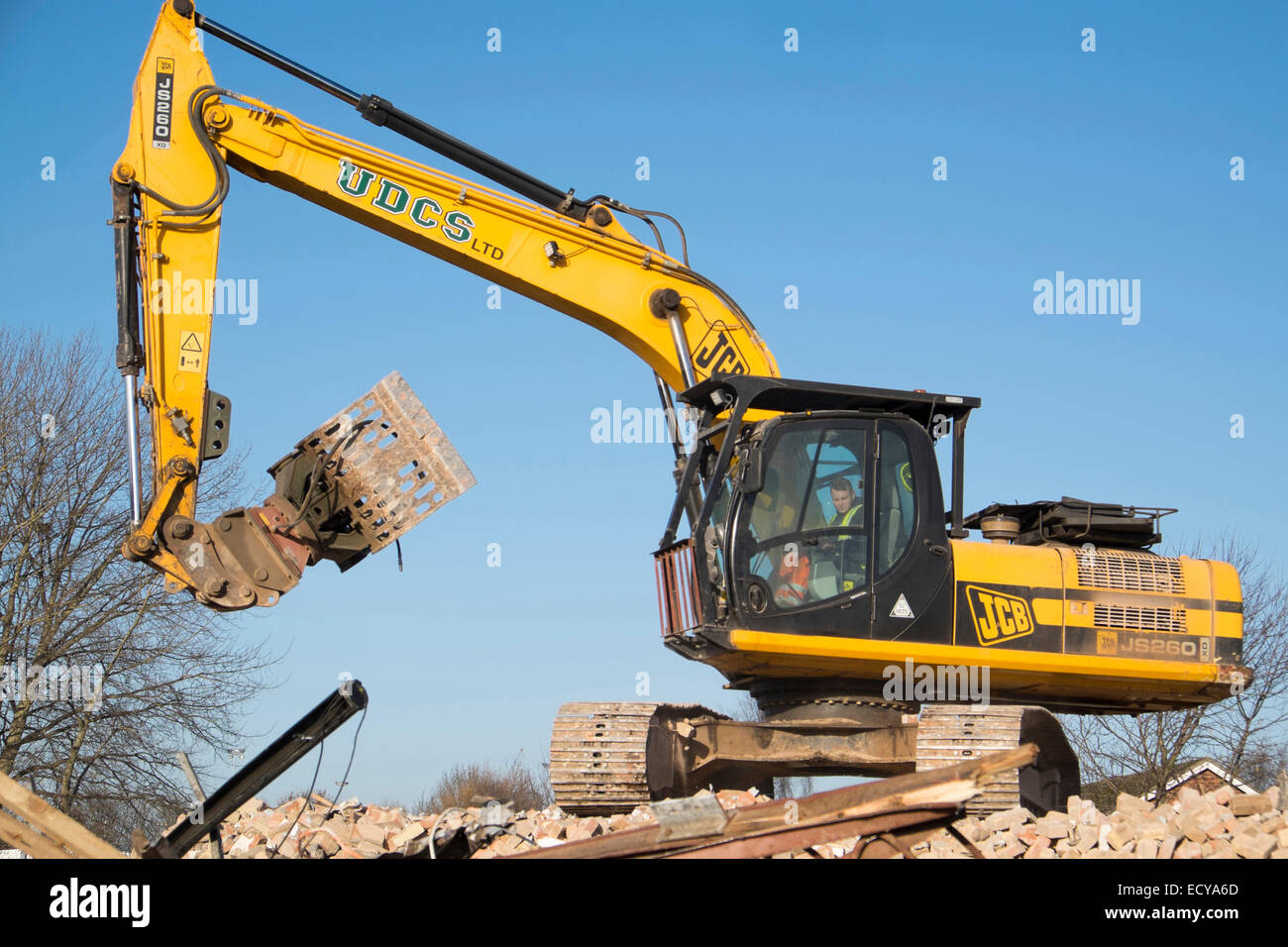 Heavy plant machinery removing rubble from a demolished house, Grantham ...