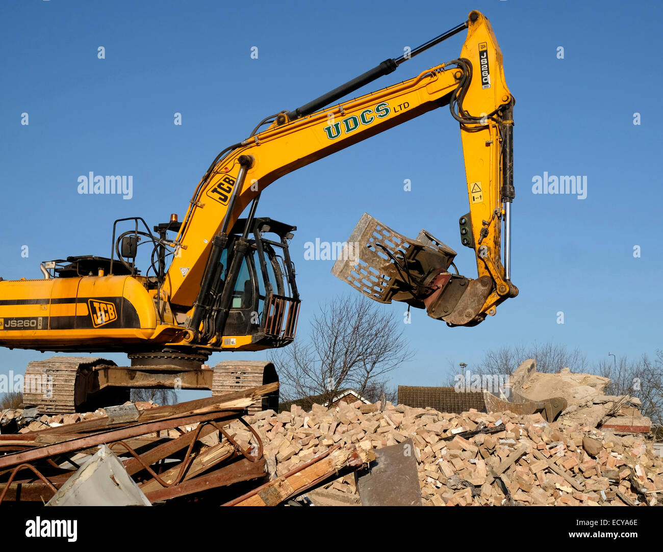 Heavy plant machinery removing rubble from a demolished house, Grantham ...