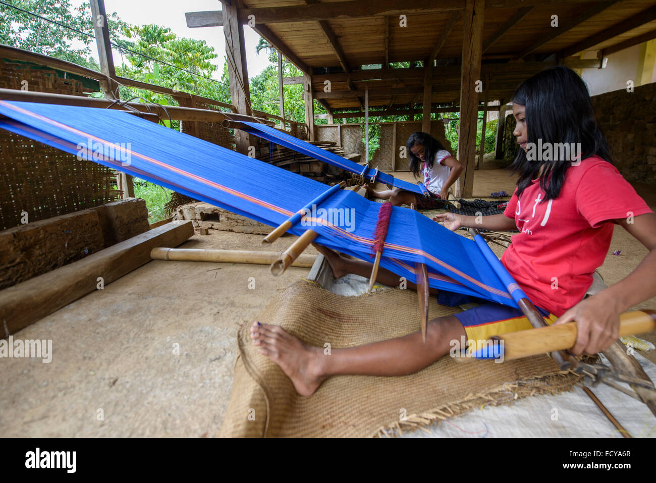 Girl weaving textiles, Sulawesi, Indonesia Stock Photo - Alamy