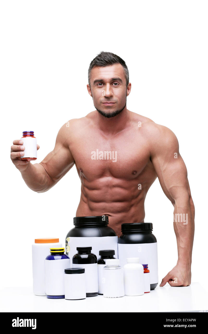 Portrait of a serious muscular man with sports nutrtion Stock Photo - Alamy