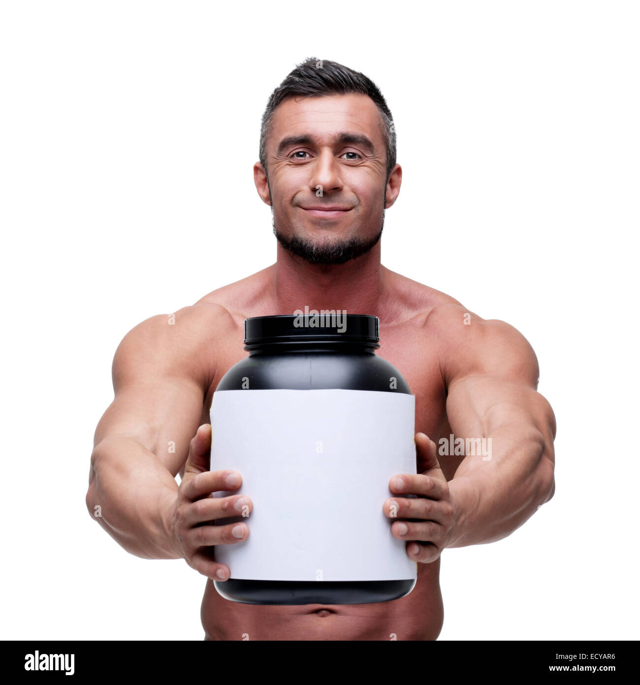 Happy muscular man holding holding jar with protein Stock Photo - Alamy