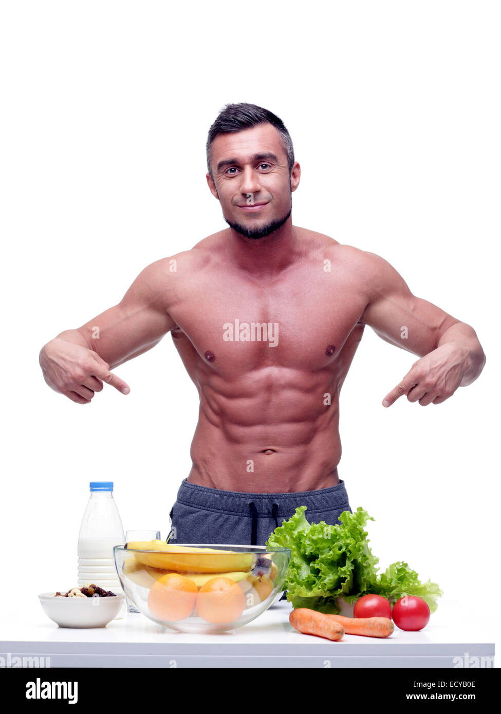 Portrait of a handsome muscular man with healthy food Stock Photo - Alamy