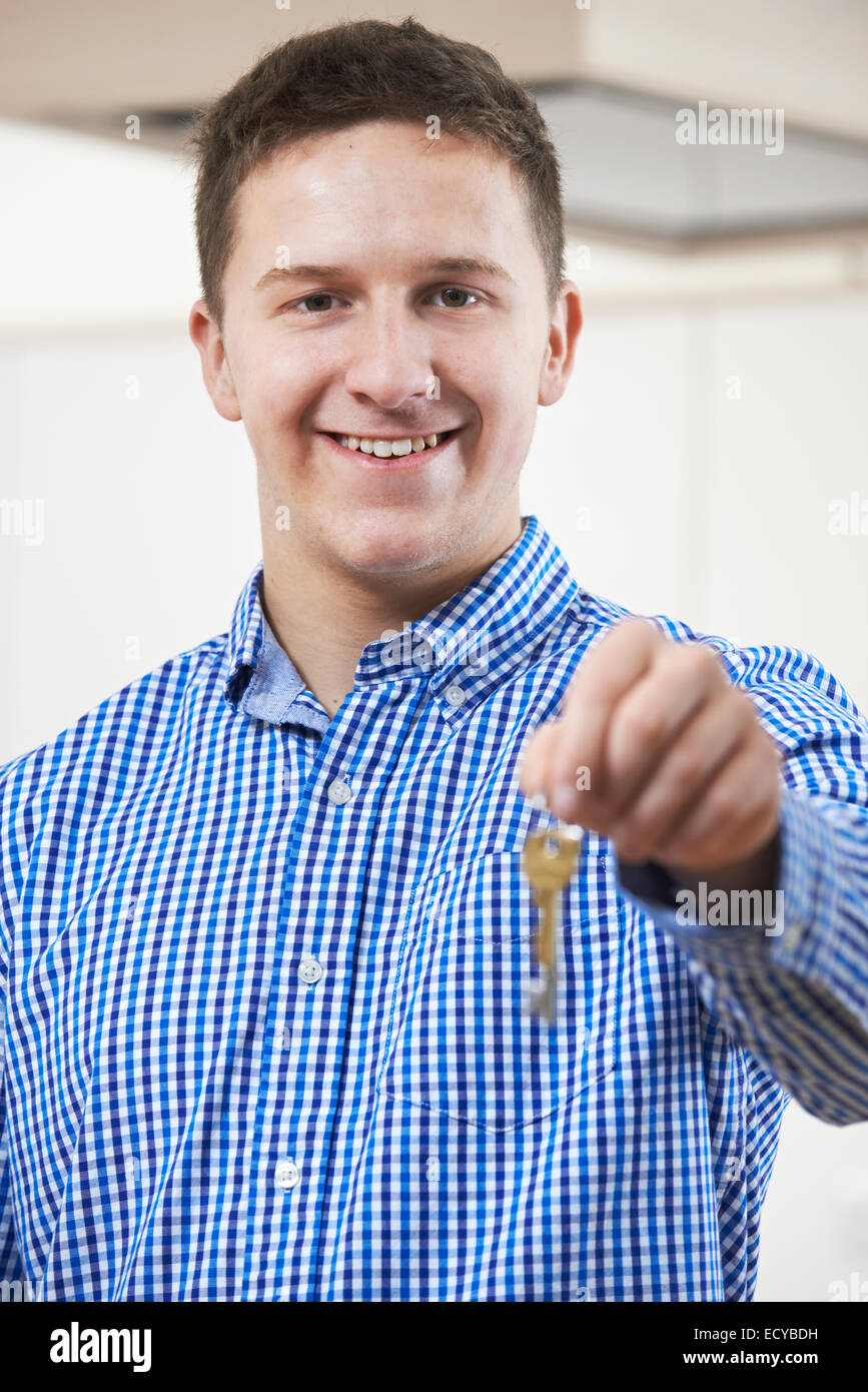 Happy Young Man Holding Keys To New Home Stock Photo - Alamy