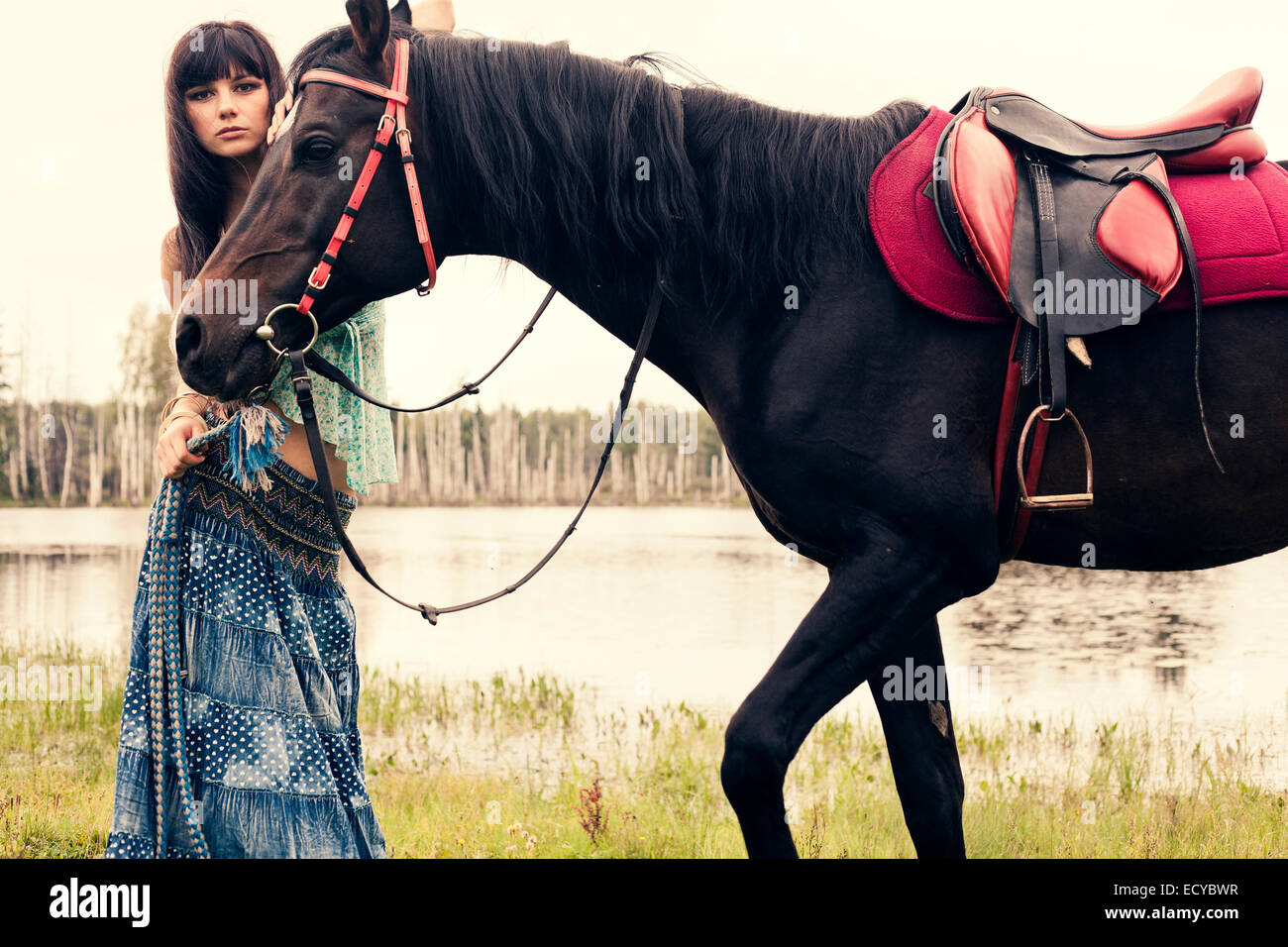 Caucasian woman walking with horse outdoors Stock Photo - Alamy