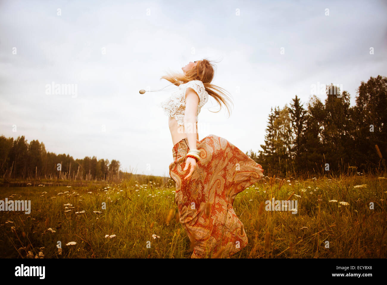 Young women dancing in countryside hi-res stock photography and images ...