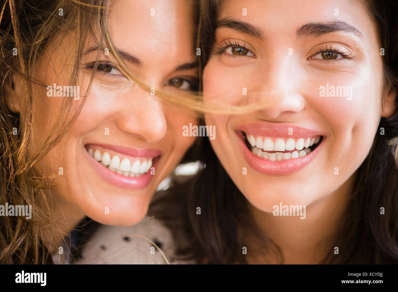 Hispanic women smiling Stock Photo - Alamy