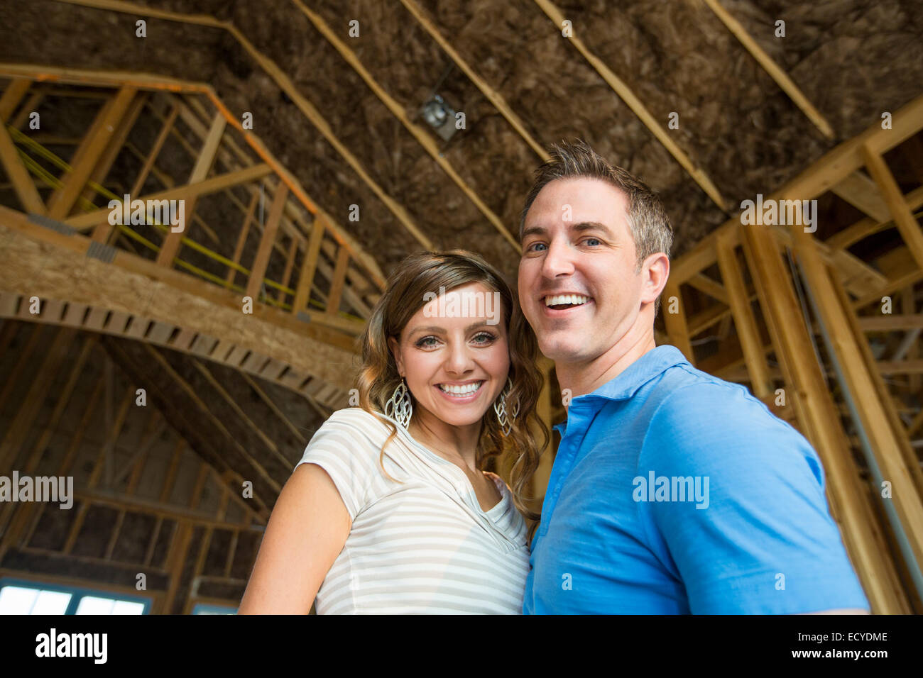 Couple posing in front house hi-res stock photography and images - Alamy