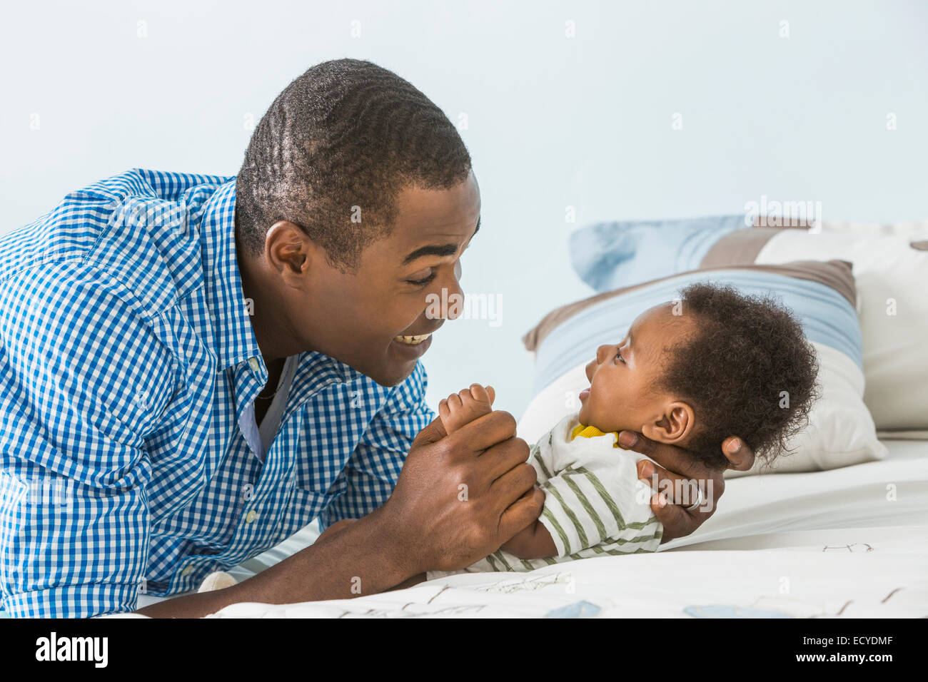Parent hands cradling baby hi-res stock photography and images - Alamy