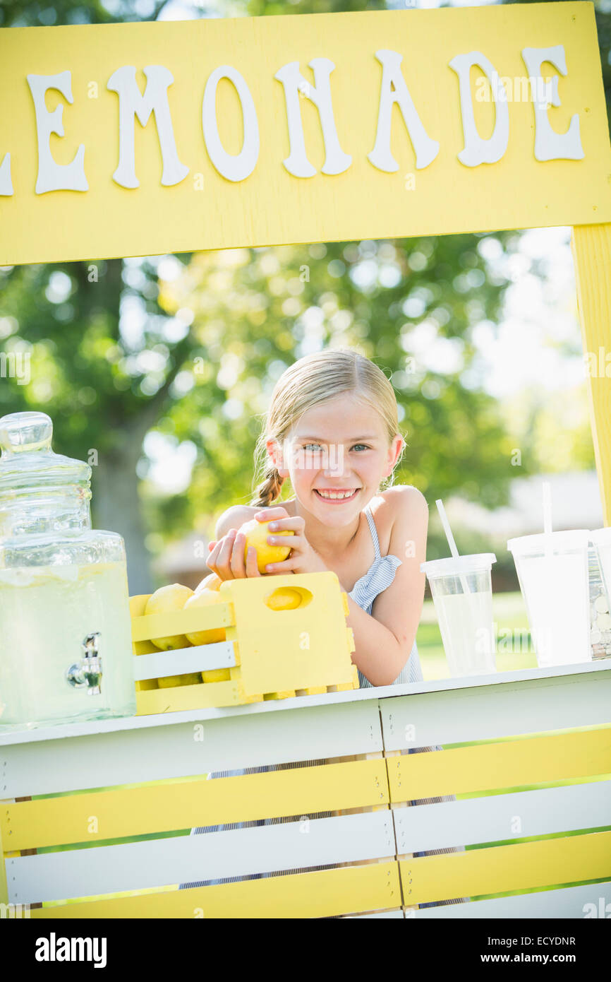 Caucasian girl smiling at lemonade stand Stock Photo - Alamy