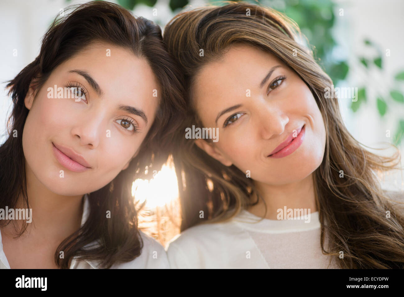 Hispanic women smiling Stock Photo - Alamy