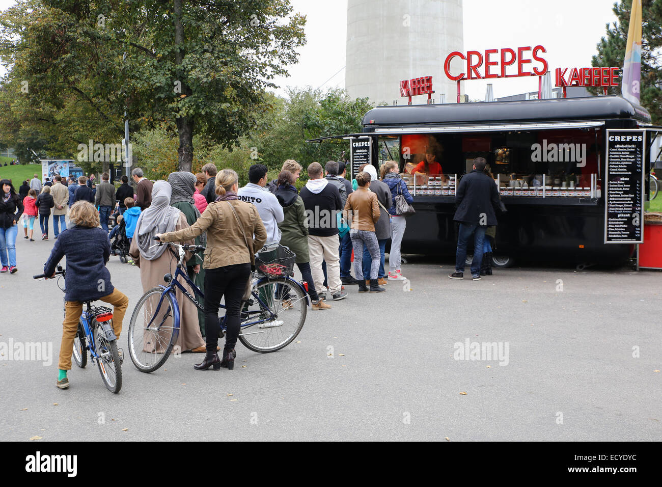 long lineup outdoor crepes vendor munich germany europe Stock Photo - Alamy