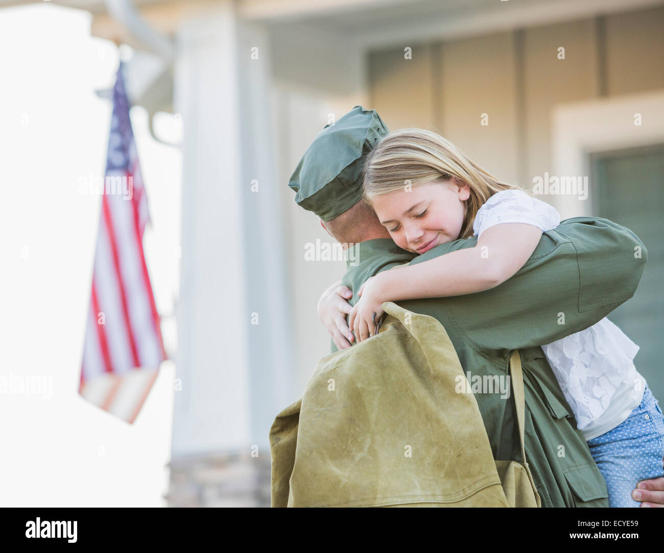 Returning Caucasian soldier hugging daughter Stock Photo - Alamy