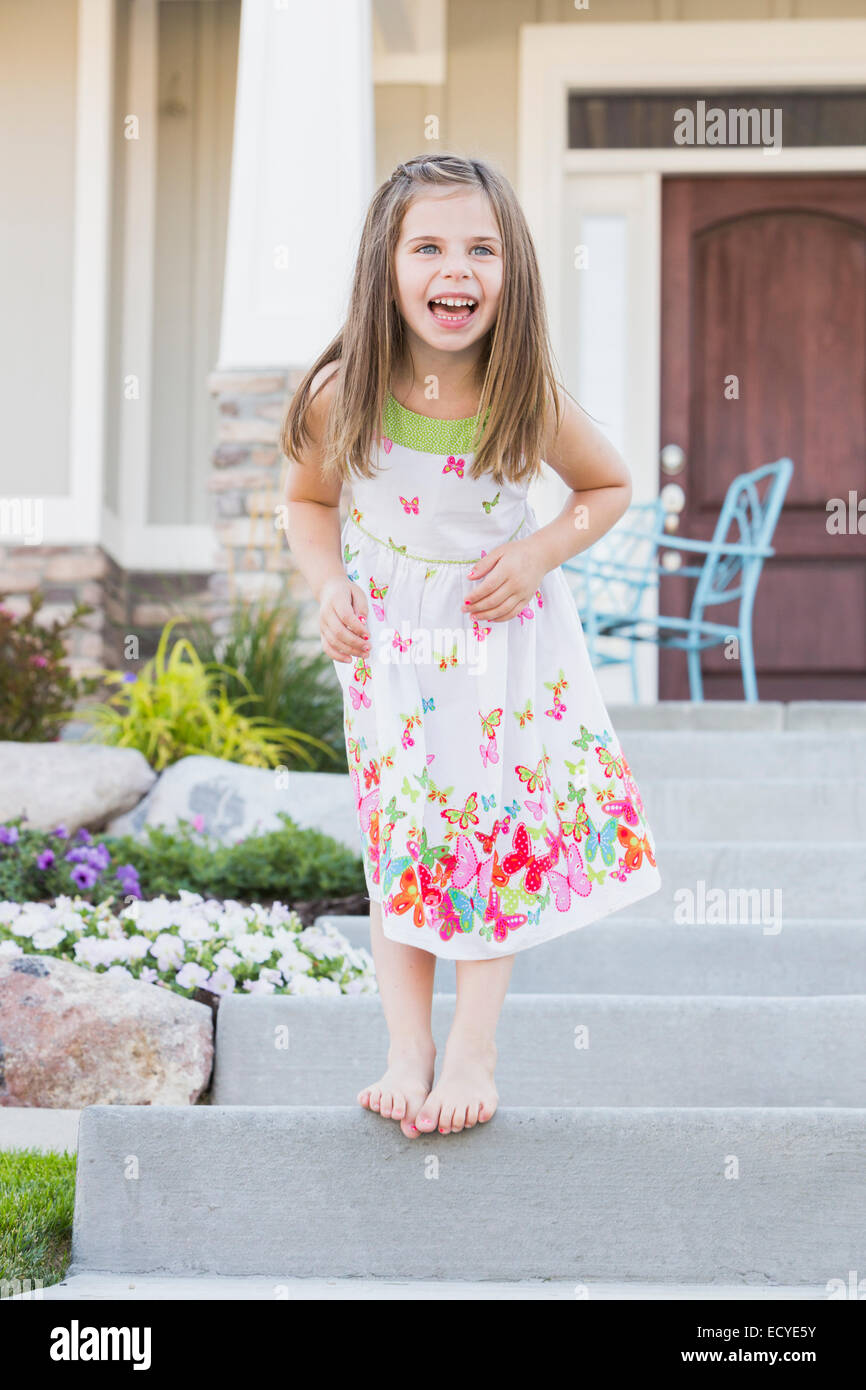 Girl on stoop hi-res stock photography and images - Alamy