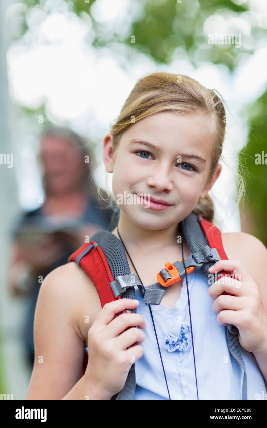 Caucasian girl hiking with backpack Stock Photo - Alamy