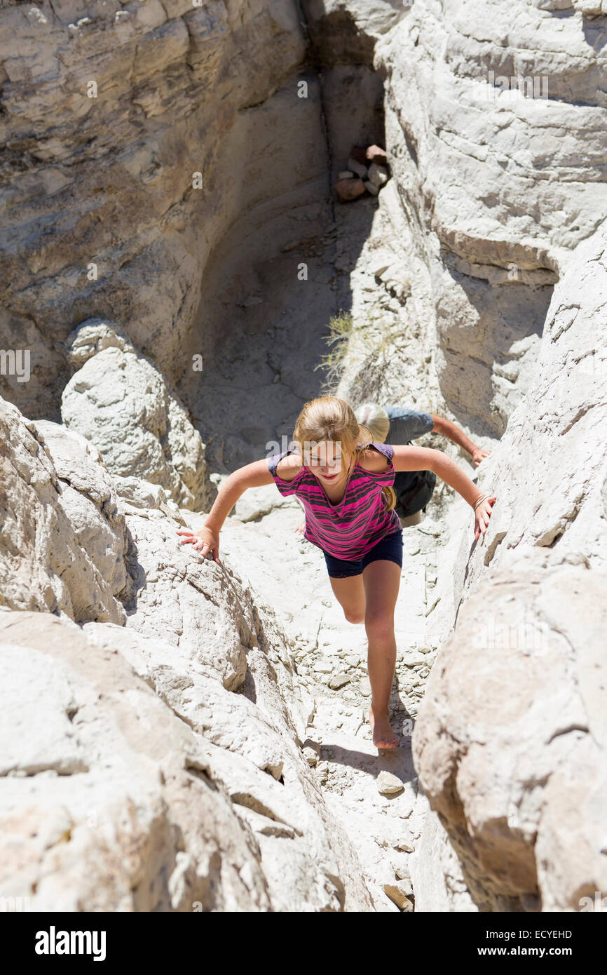 Caucasian girl climbing rock formations Stock Photo - Alamy