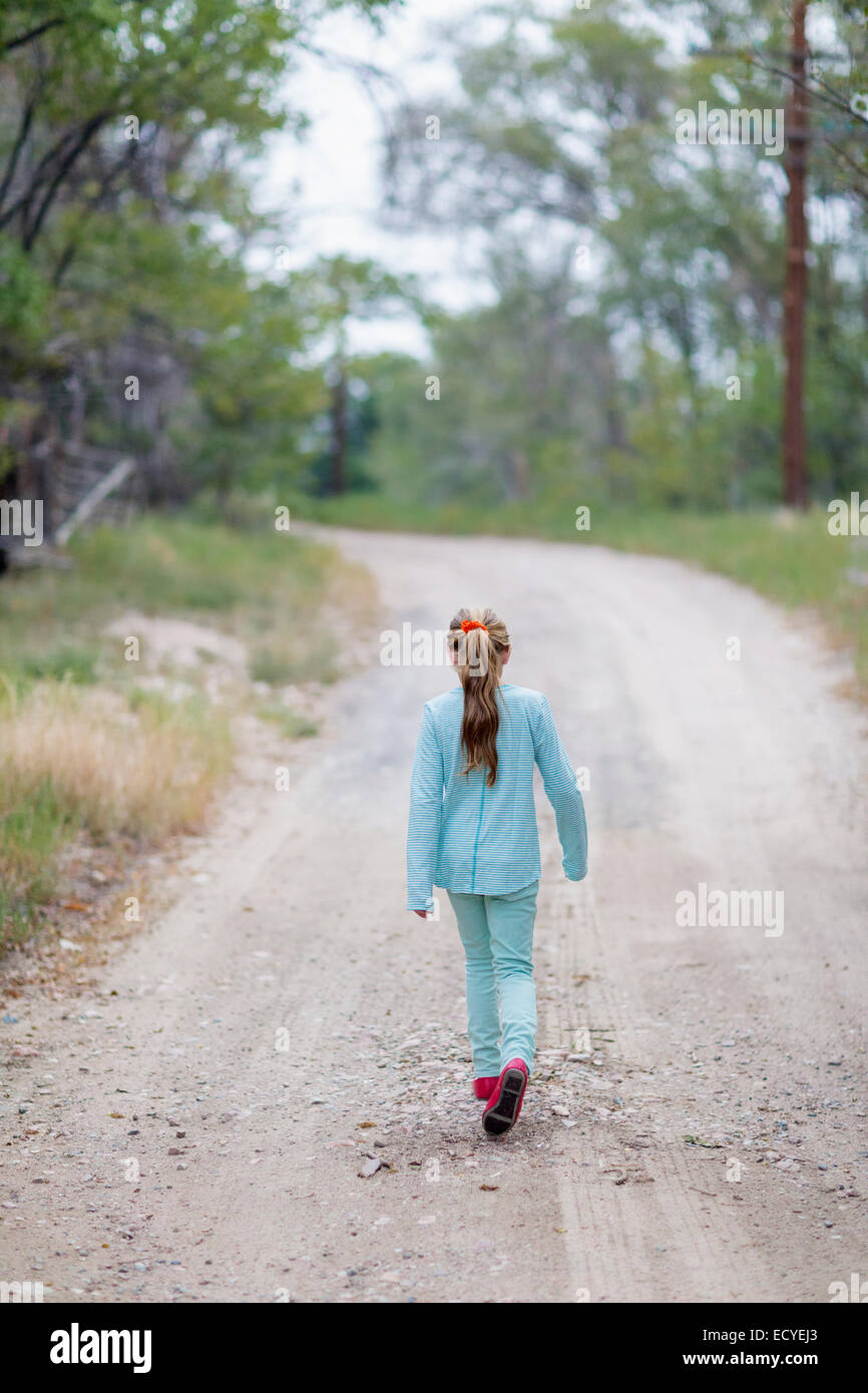 Girl walking road hi-res stock photography and images - Alamy