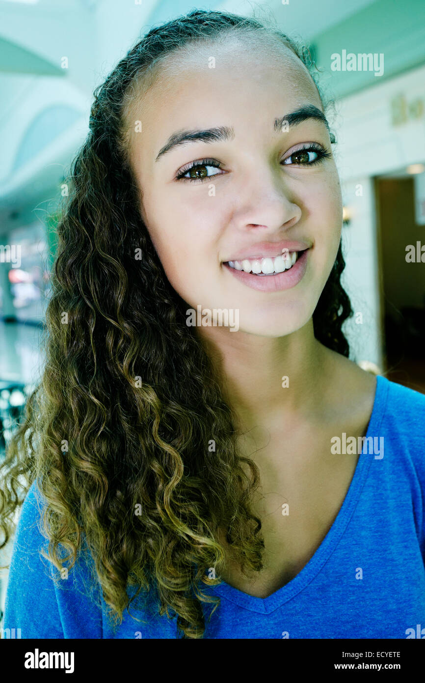Close up of mixed race teenage girl smiling Stock Photo - Alamy