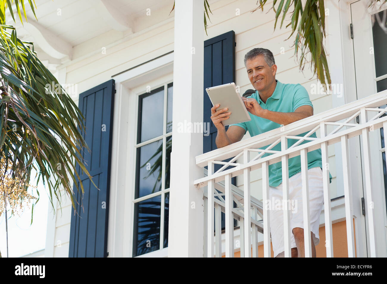 Man leaning on balcony hi-res stock photography and images - Alamy