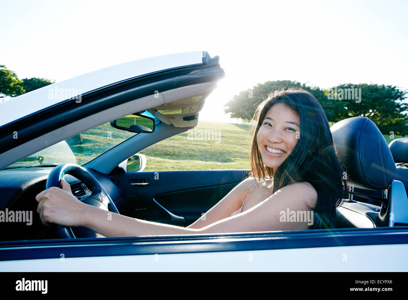 Chinese woman driving convertible Stock Photo - Alamy