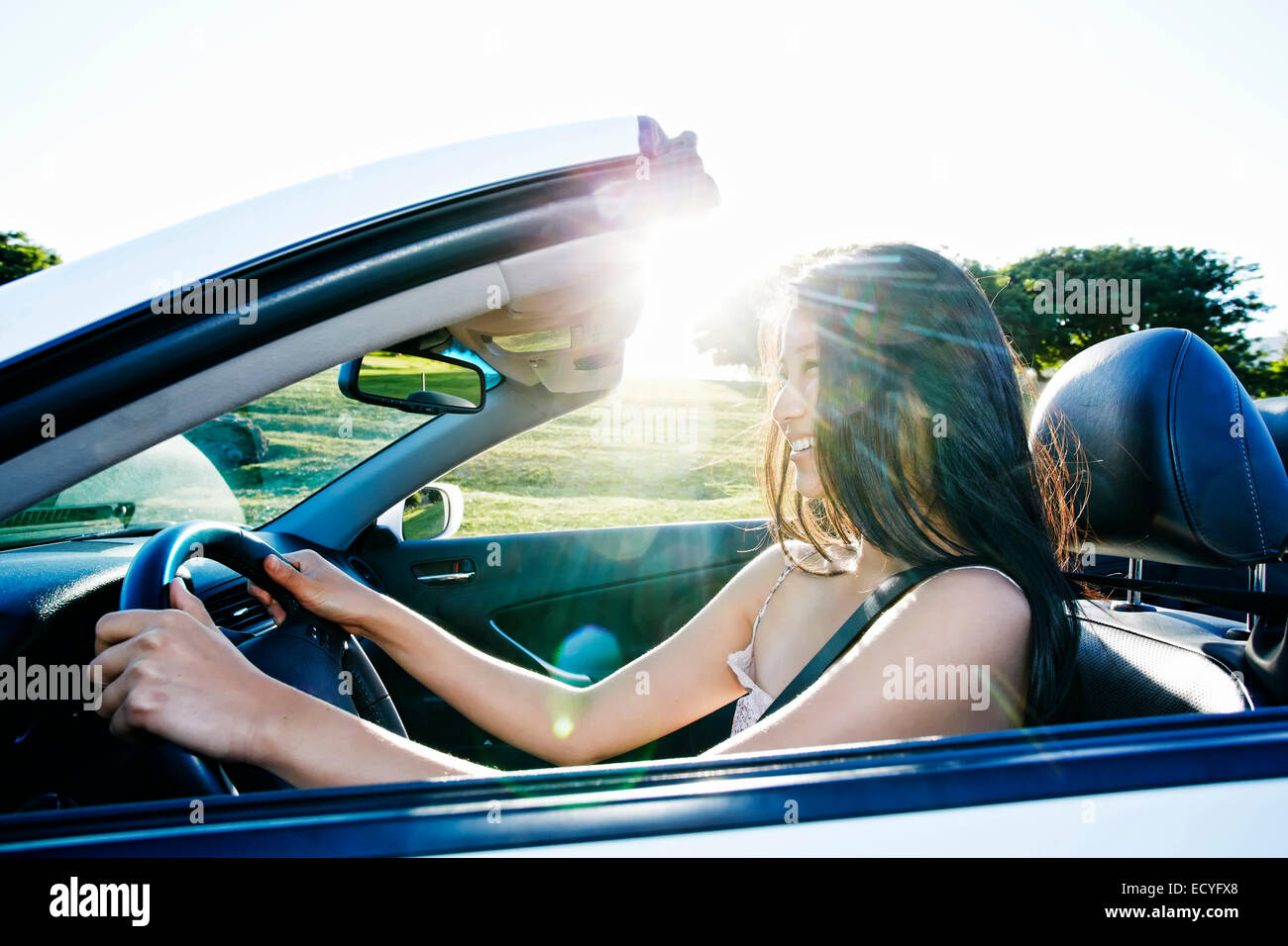 Chinese woman driving convertible Stock Photo - Alamy