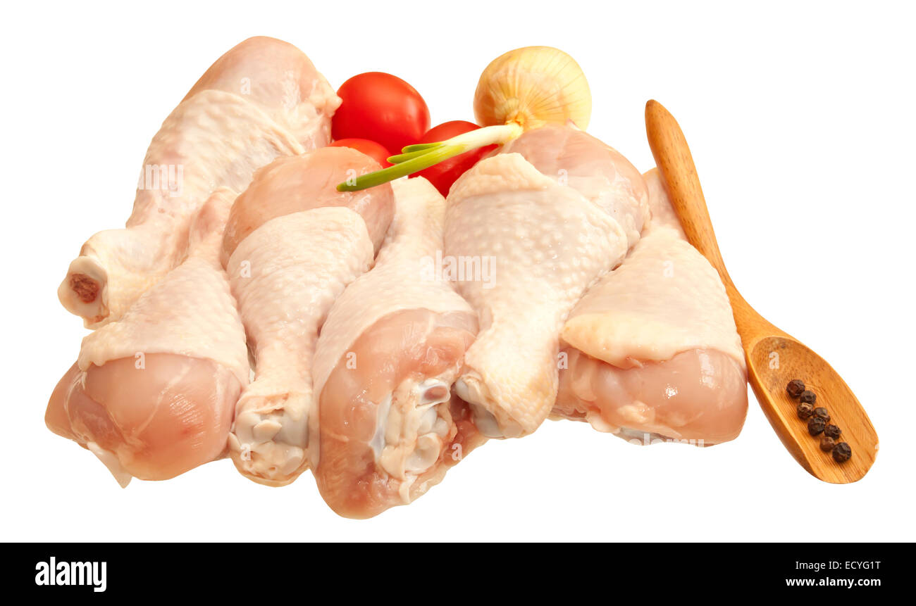 Raw chicken legs with vegetables, isolated on white background Stock ...