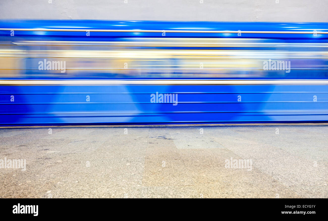 Blue subway train in motion at the underground station Stock Photo - Alamy