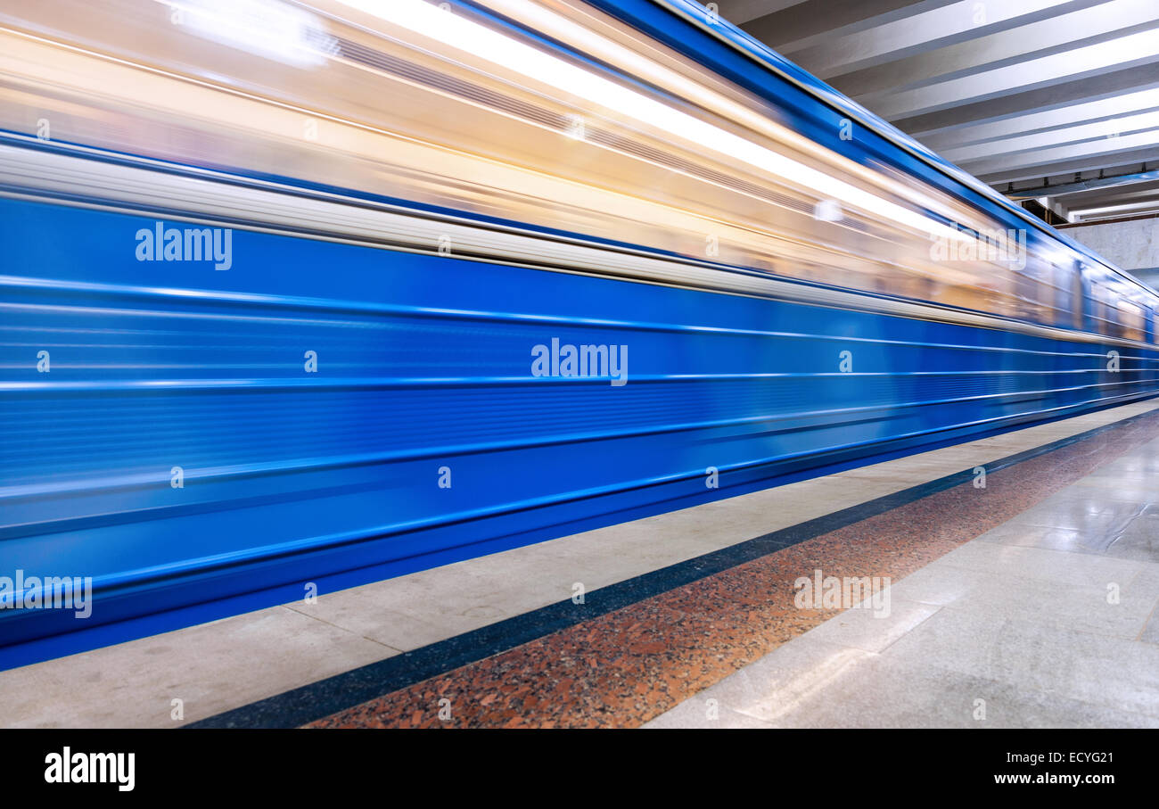 Blue subway train in motion at the underground station Stock Photo - Alamy